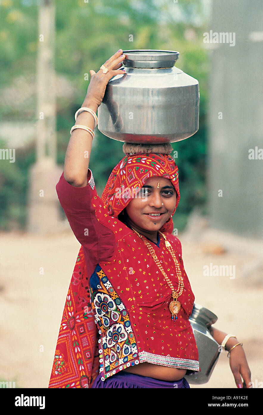 NMJ99703 Tribal Indian Women Carrying Water pot on her head Saurashtra ...