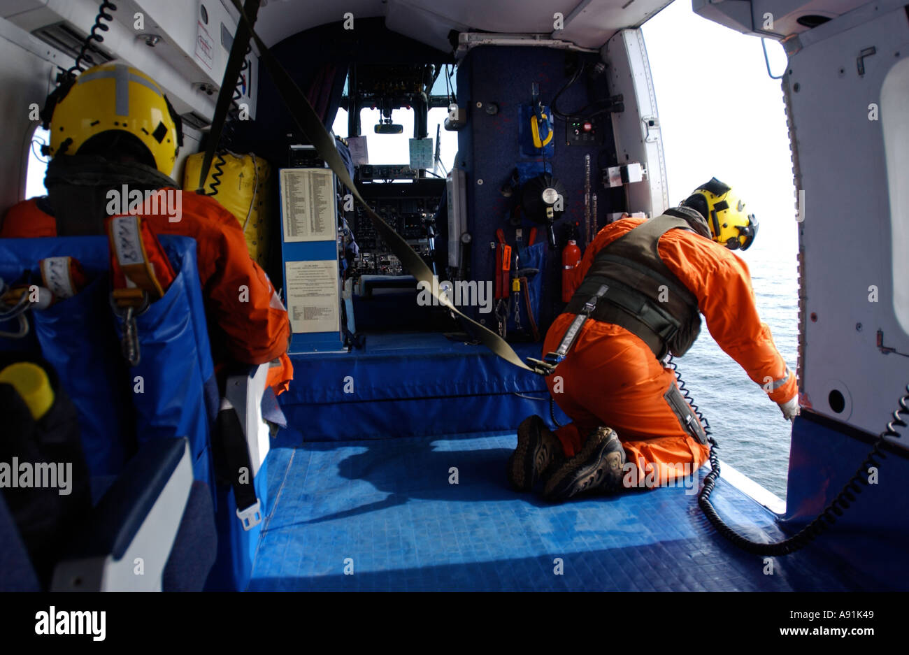 Crew in action in a Coastguard Rescue Helicopter Stock Photo - Alamy
