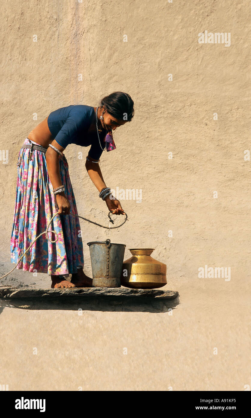 Village girl taking water from well Rajasthan India Stock Photo - Alamy