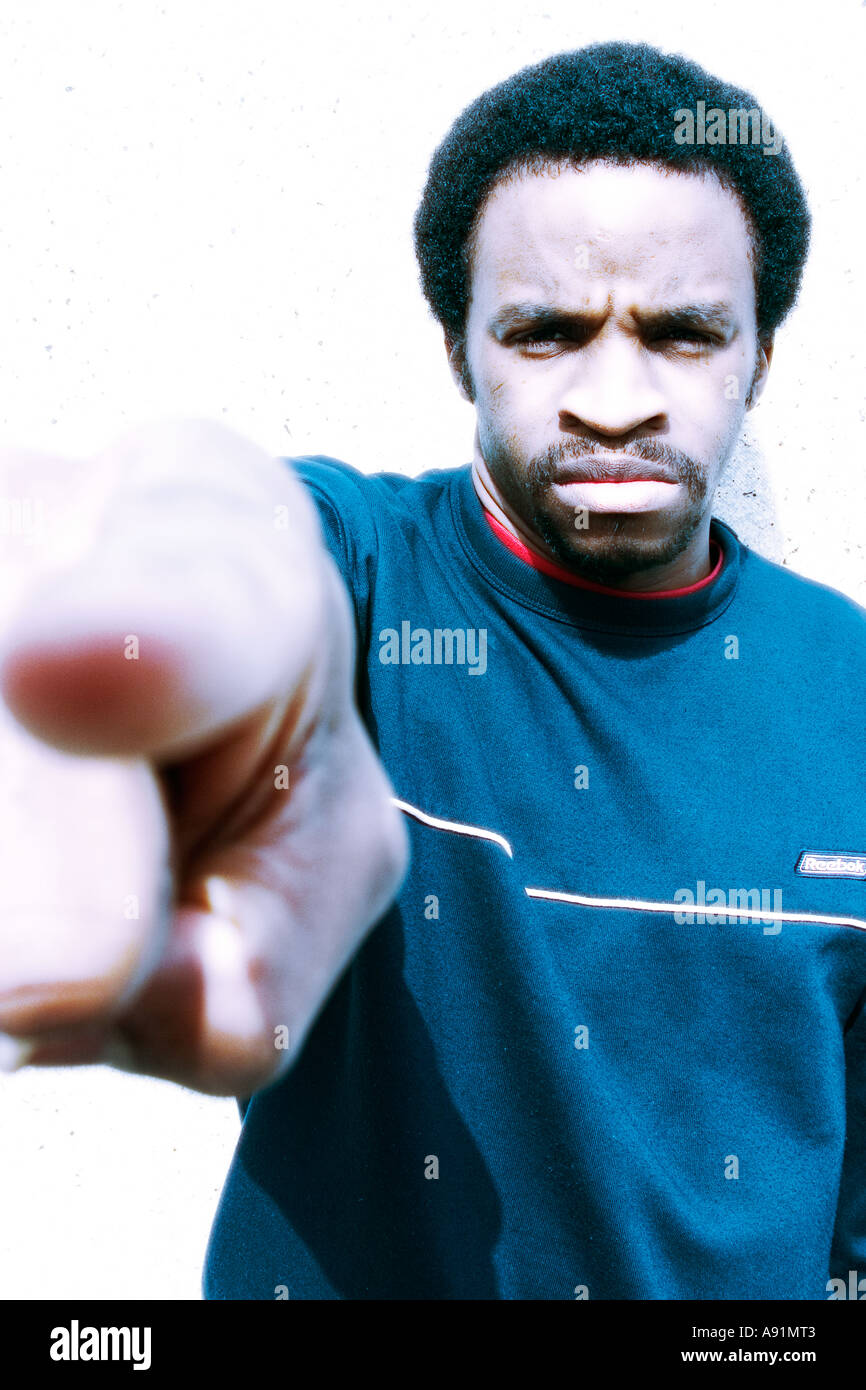 cross processed image of colored male pointing at camera with one hand ...