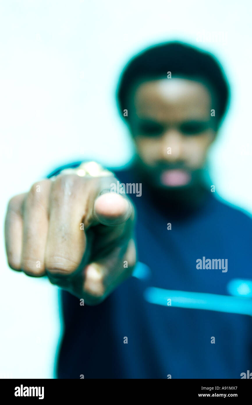 cross processed image of colored male pointing at camera with one hand ...