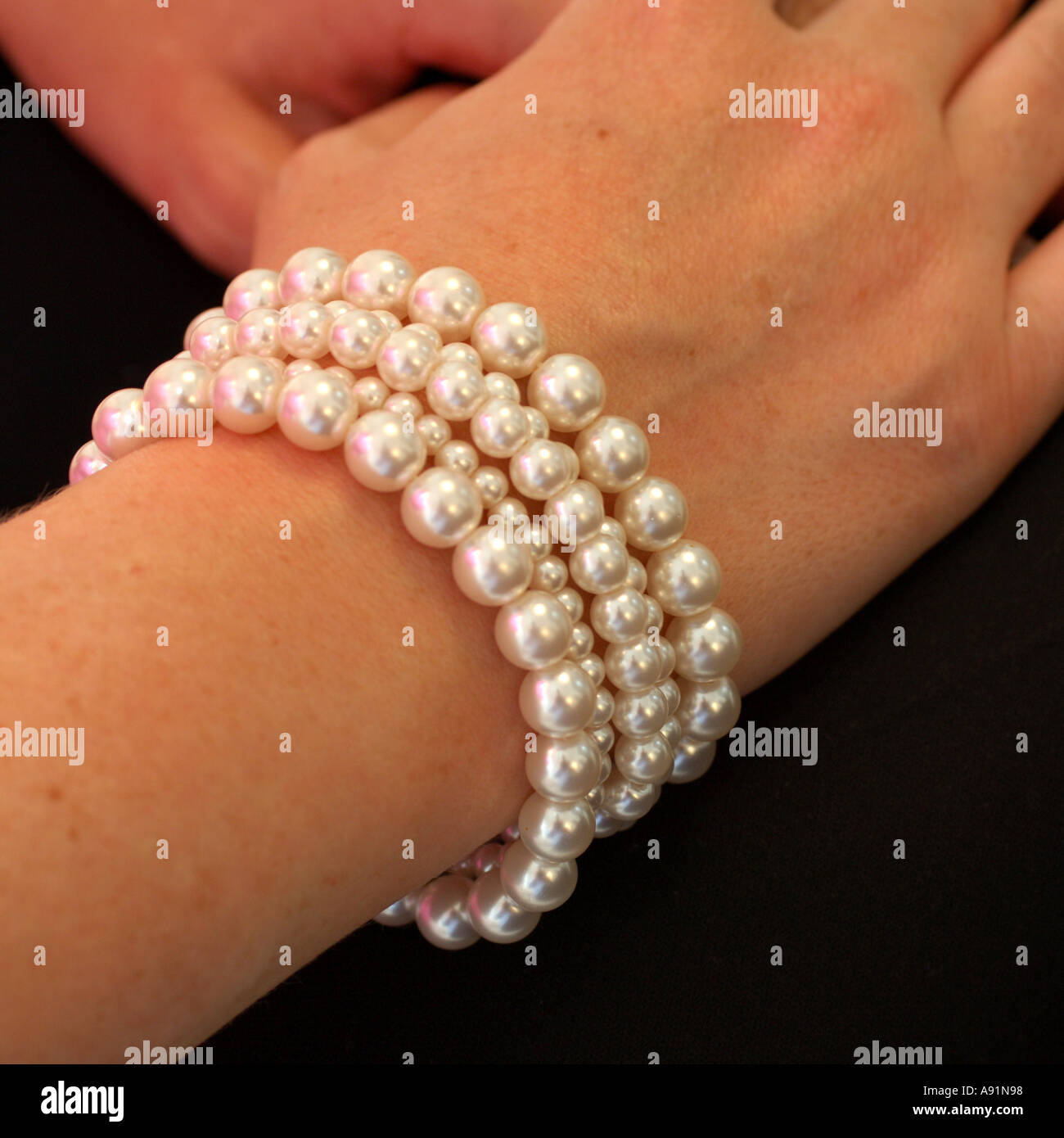 Woman s bracelet and wrist close up Stock Photo - Alamy