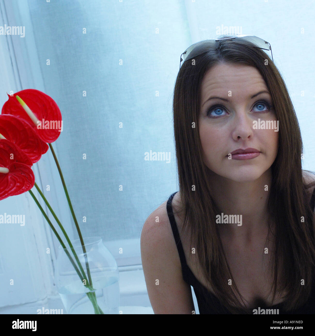 Young woman looking up Stock Photo - Alamy