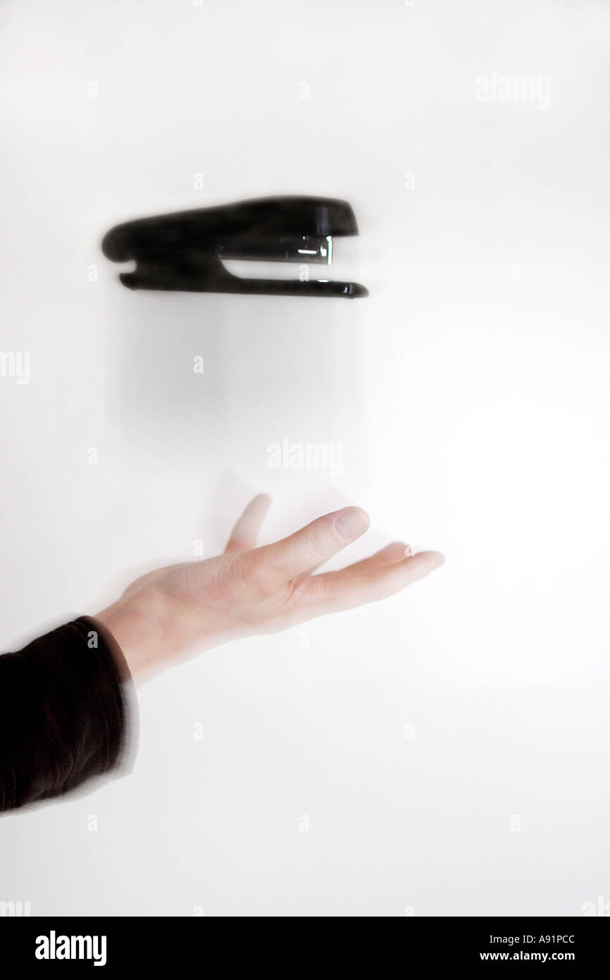Hand throwing stapler Stock Photo - Alamy