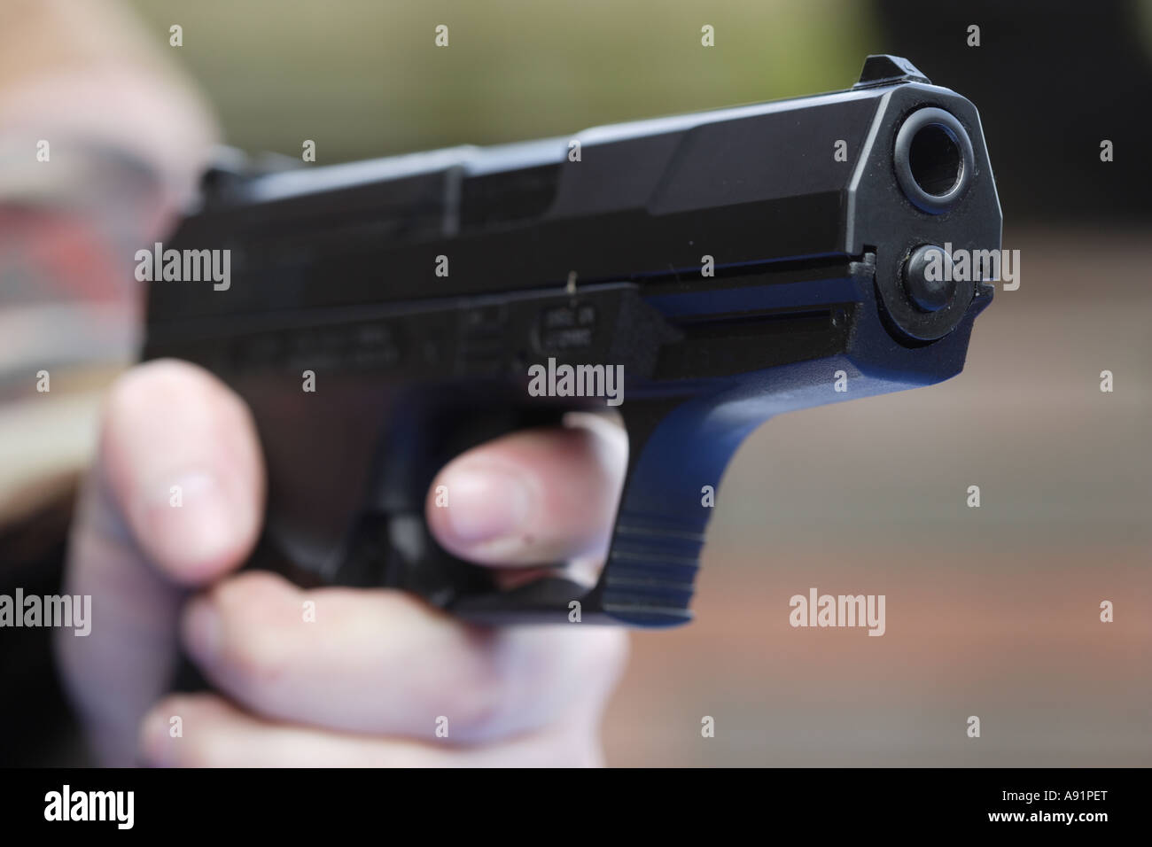 Finger at the trigger of a pistol Walther P99 Stock Photo - Alamy