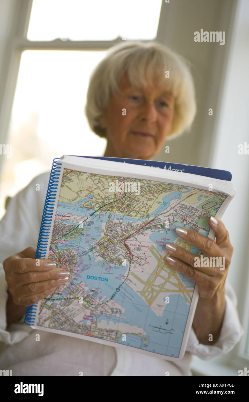 Senior Woman reading map Stock Photo - Alamy