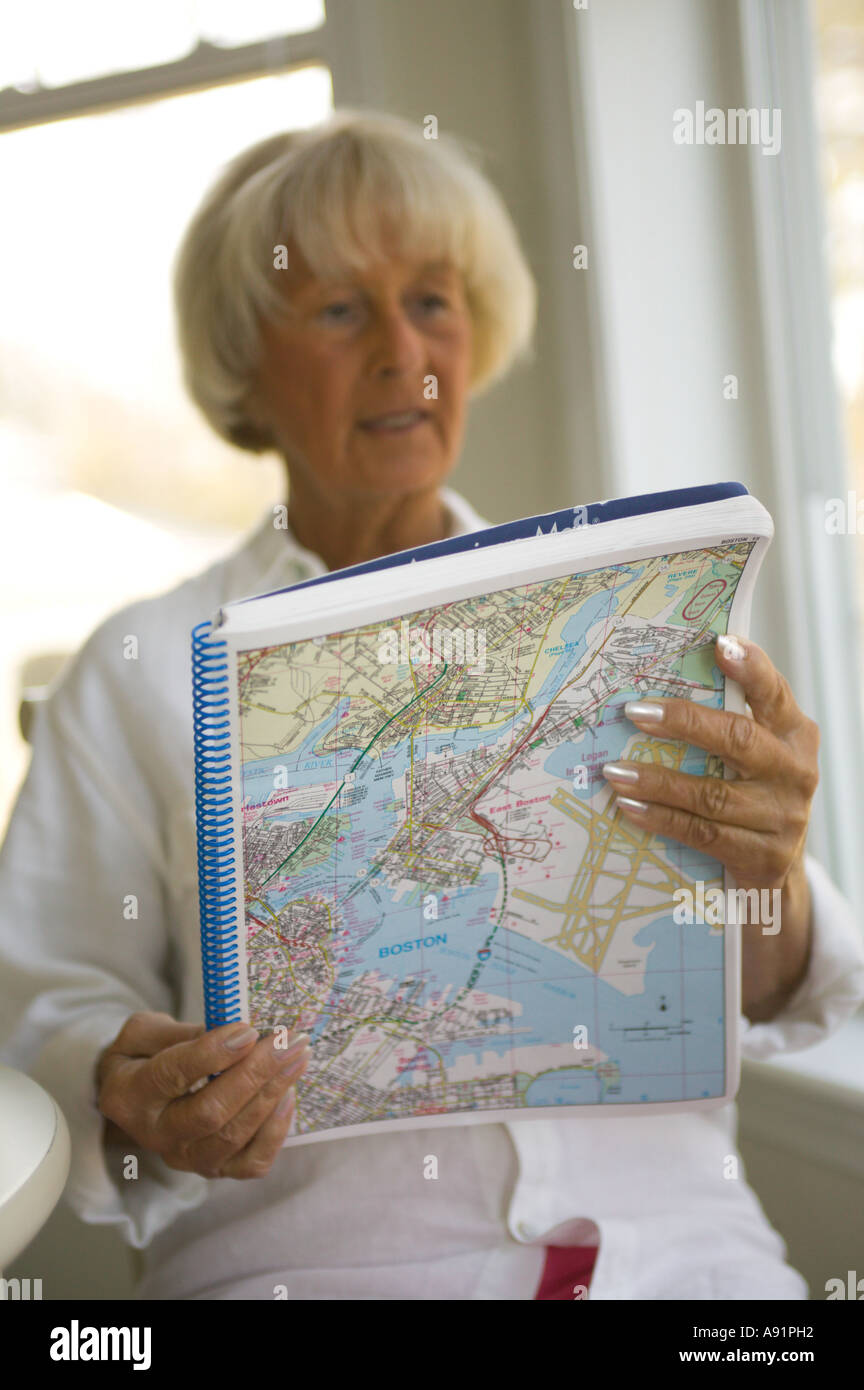 Senior Woman reading map Stock Photo - Alamy