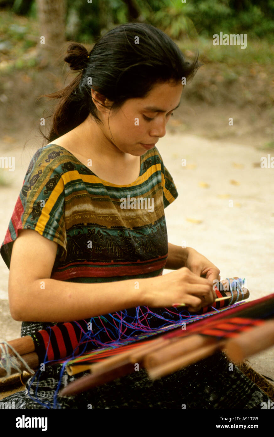 Maya woman weaving fabric, Tikal National Park, Guatemala Stock Photo ...