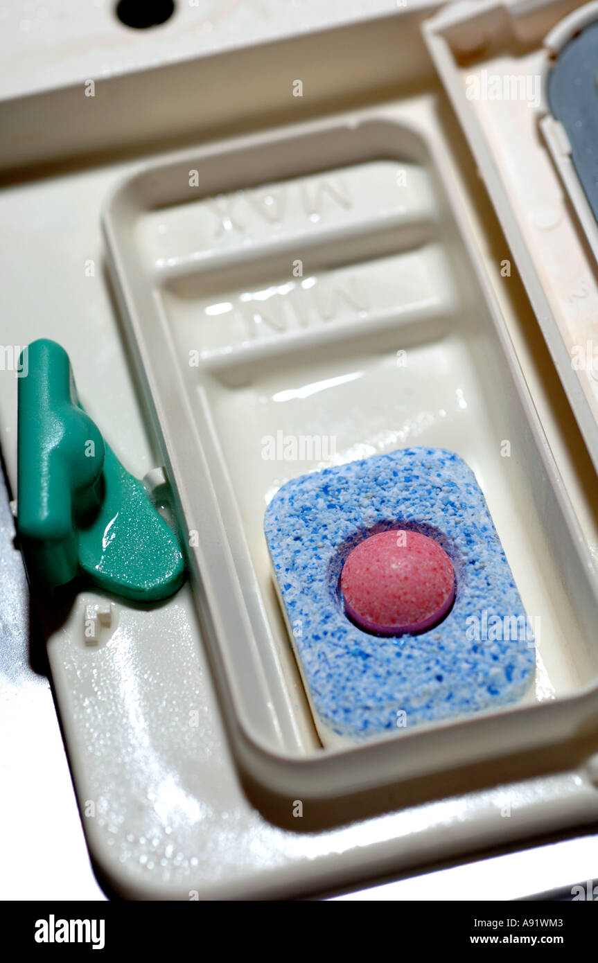 Dishwasher soap tablet in machine Stock Photo - Alamy