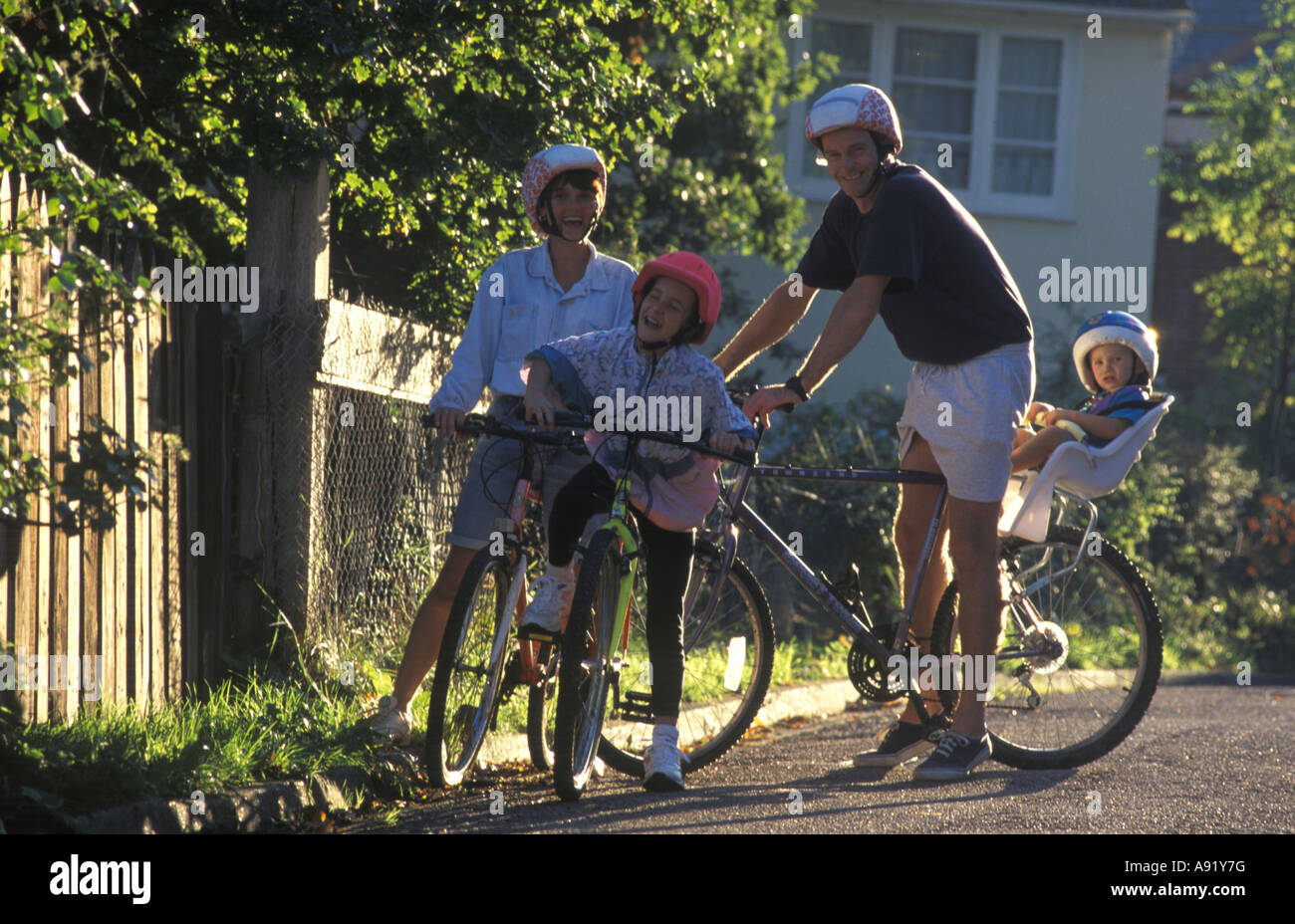 Happy mother daughter rides bicycle hi-res stock photography and images ...