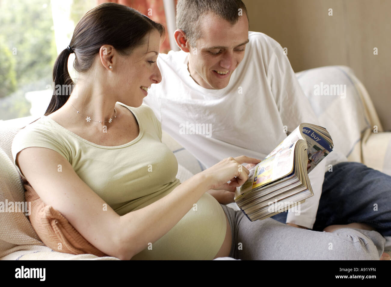 Partner feeling baby kick Stock Photo - Alamy