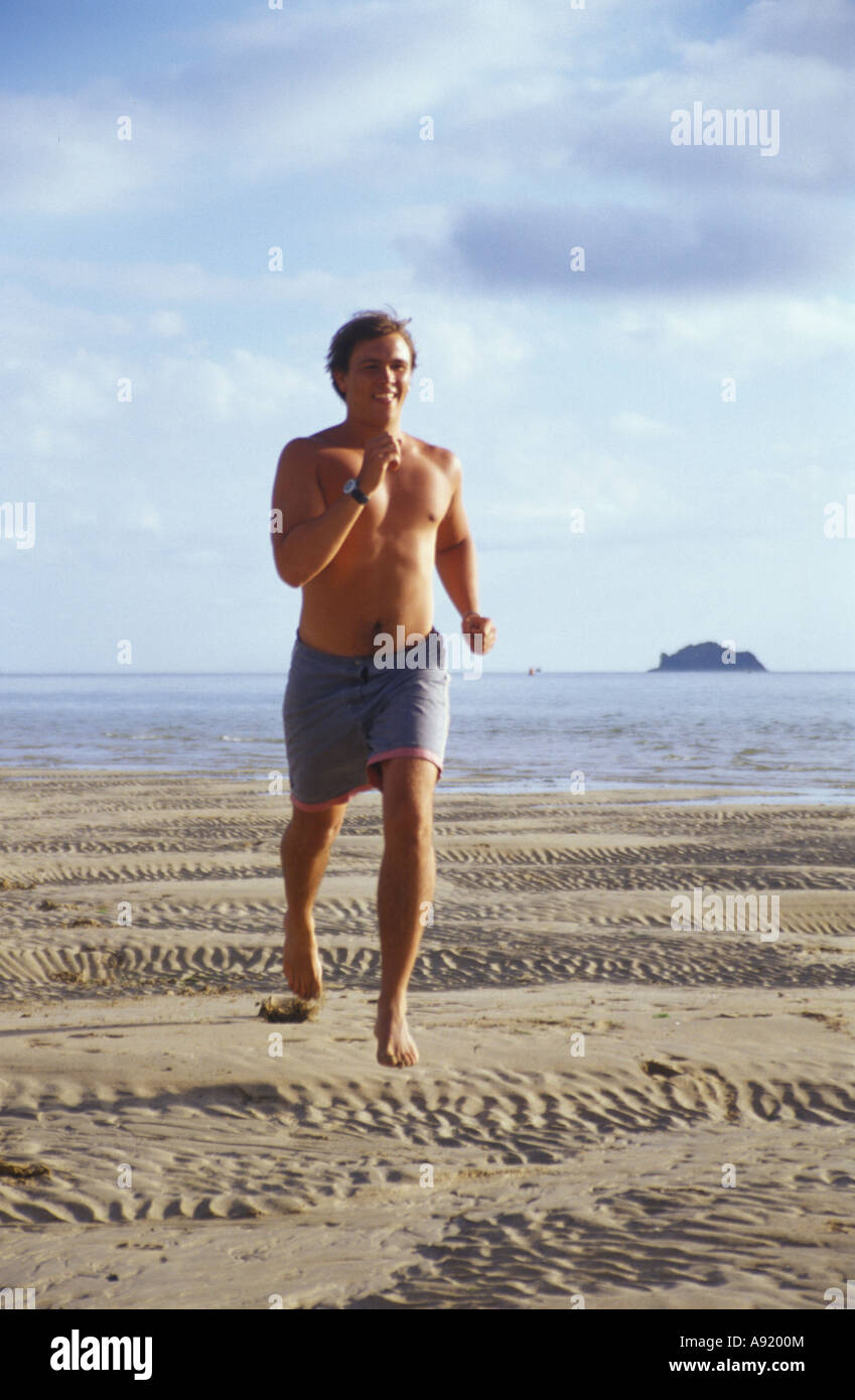 man jogging on the beach Stock Photo - Alamy