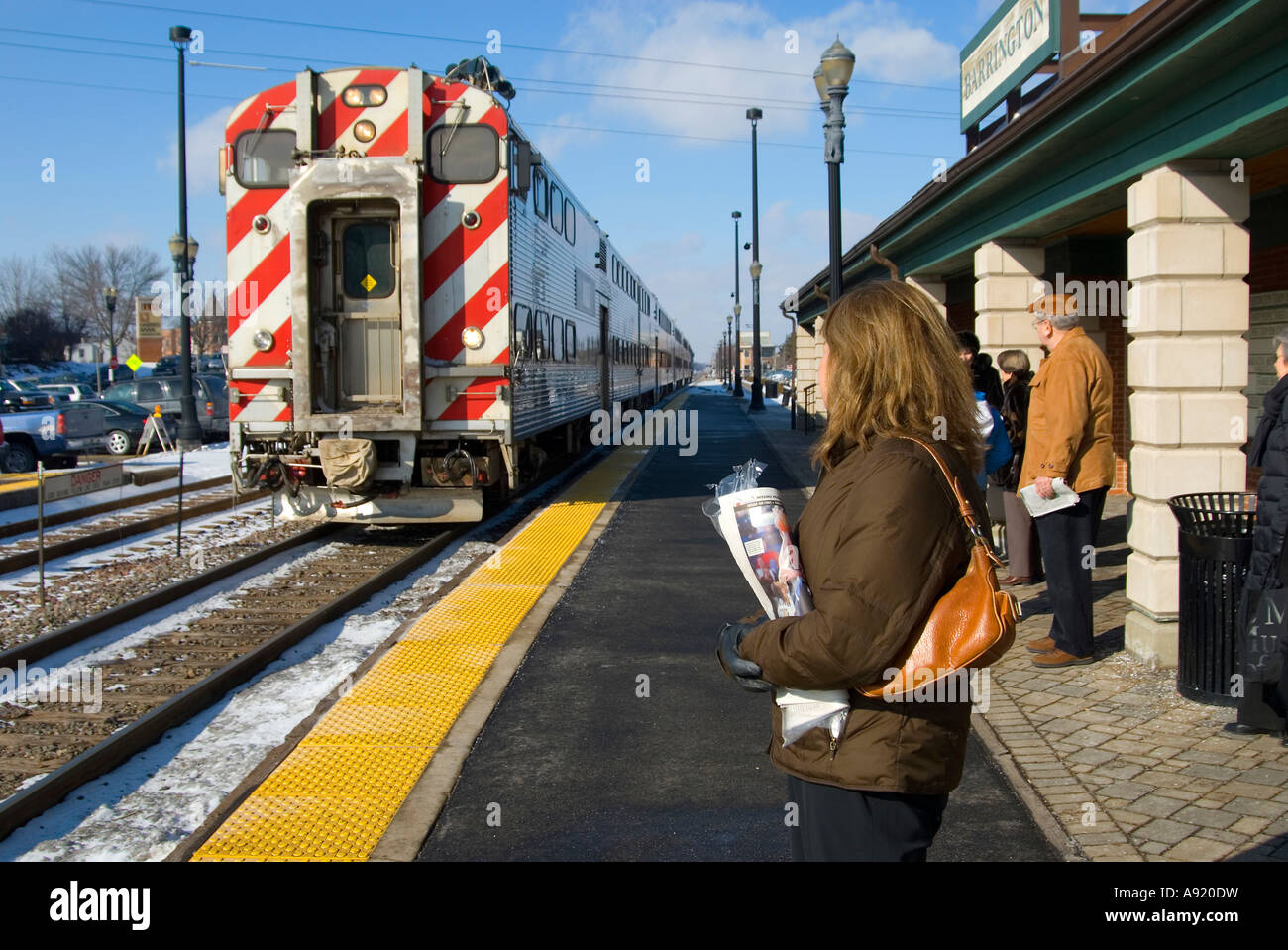 Commuter Waiting for Train Stock Photo - Alamy