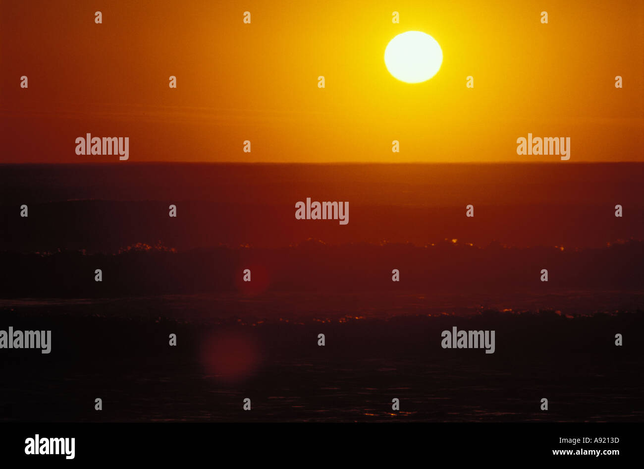 Sun over water Stock Photo - Alamy