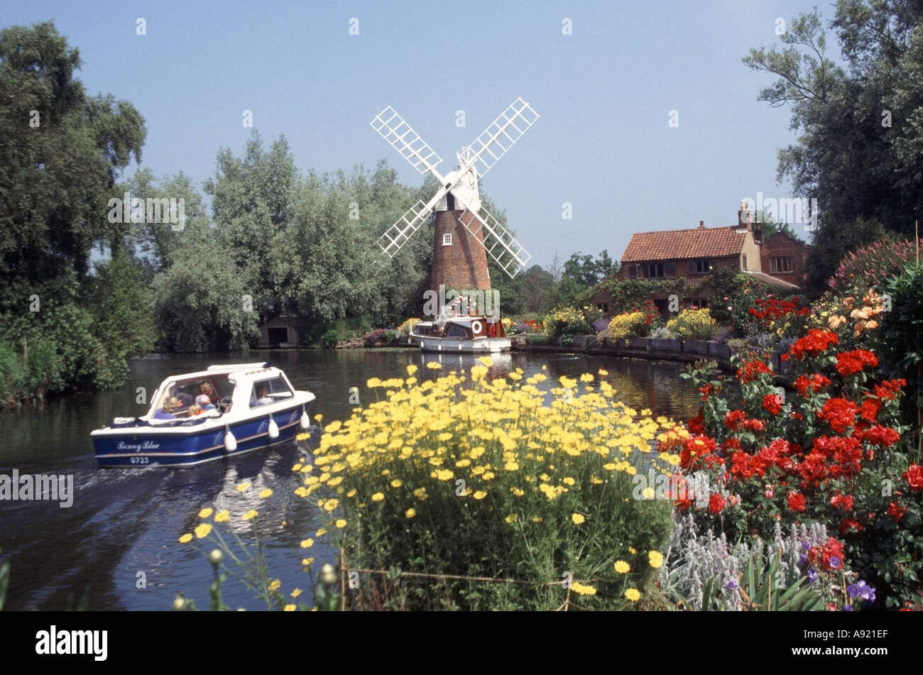 Norfolk Broads boat at Hunsett Mill windmill English cottage garden ...