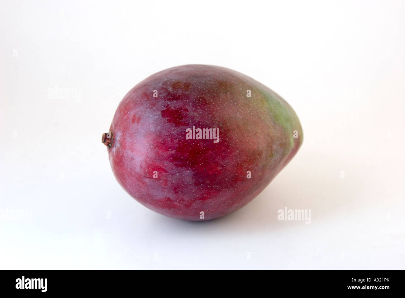 Red and green mango on a white background Stock Photo - Alamy