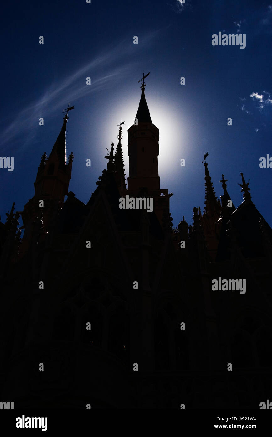 Cinderella's Castle in the dark with the moon behind the main tower ...
