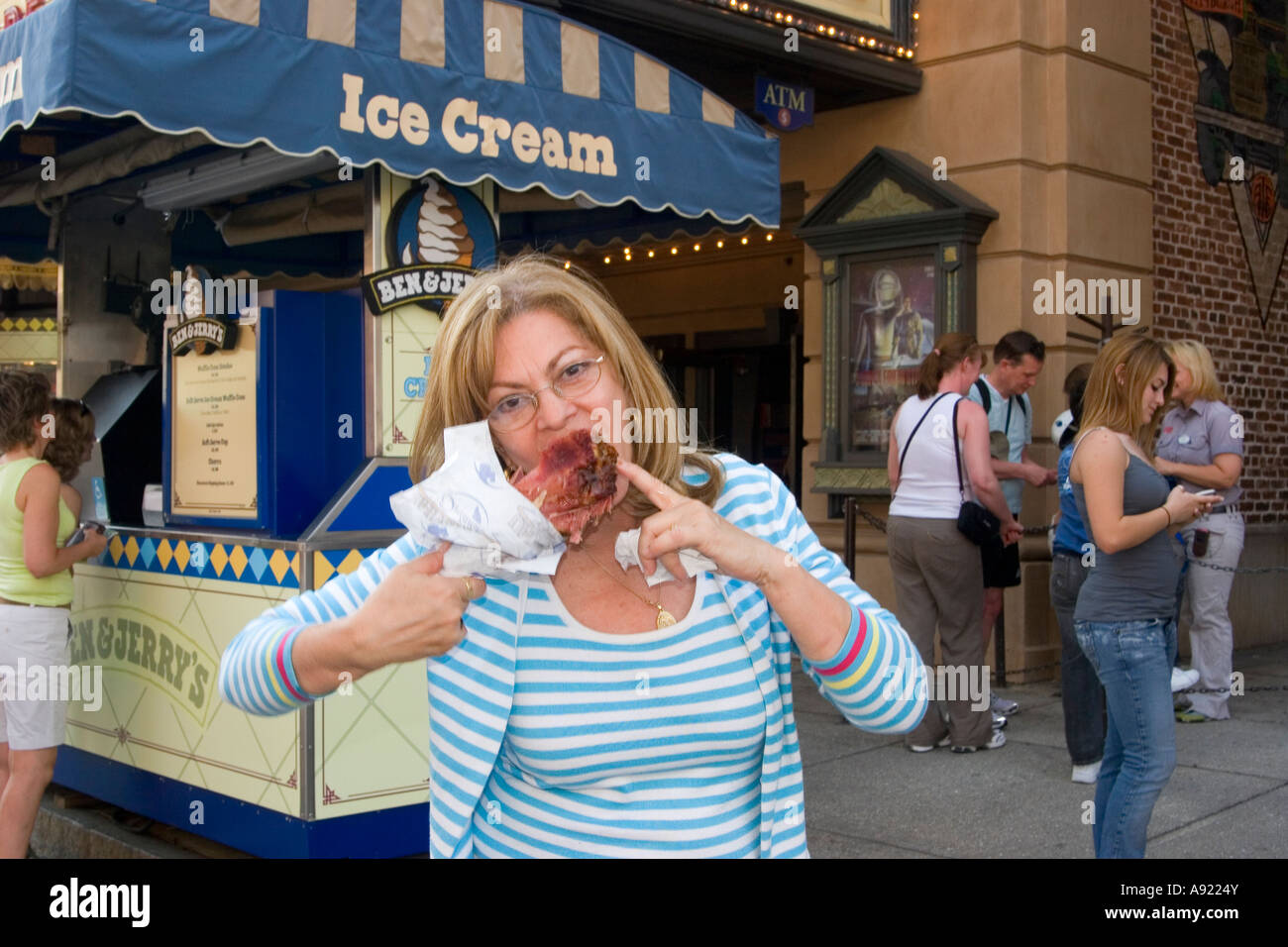 A woman eats a huge turkey drumstick Stock Photo - Alamy