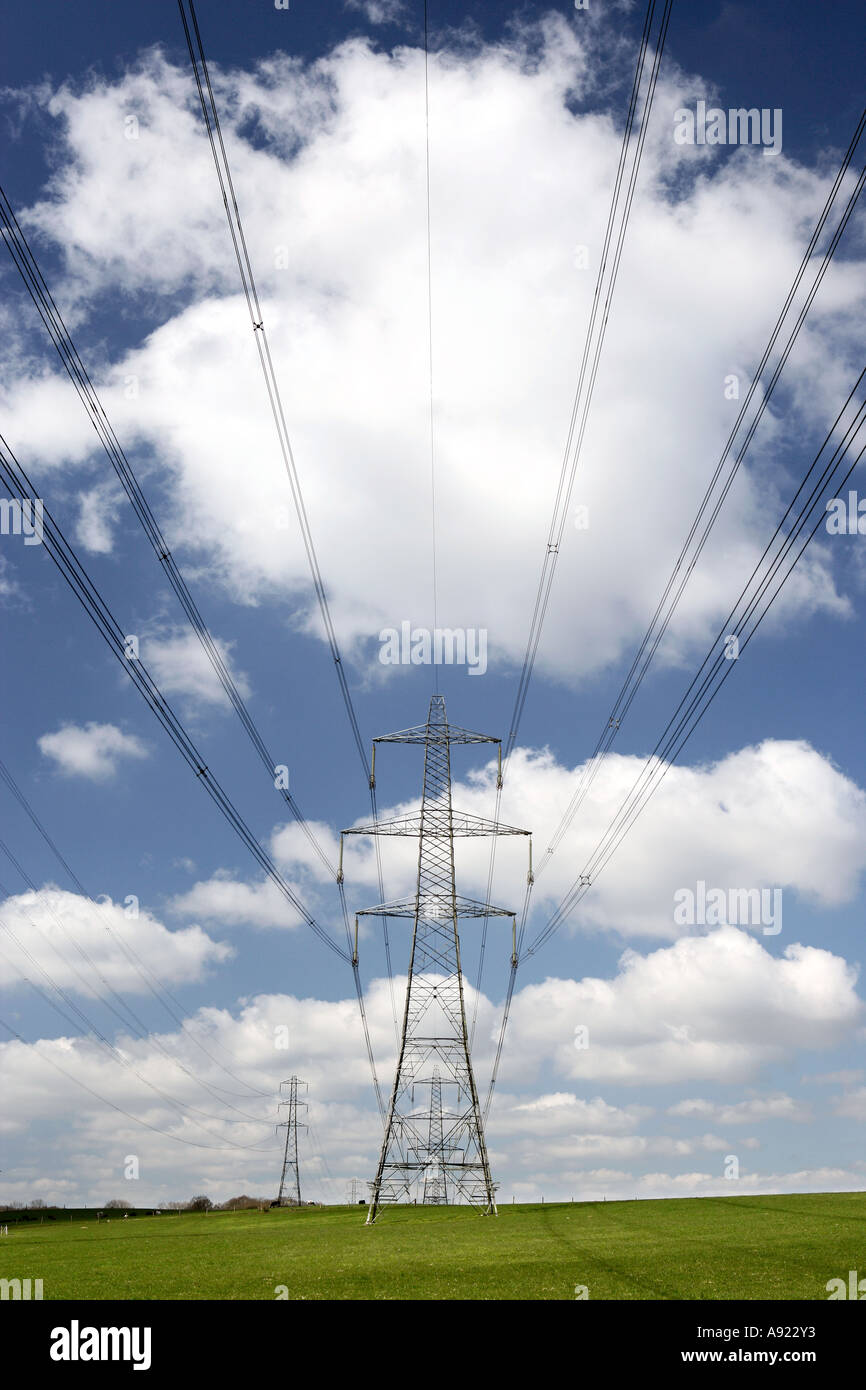 Blue Sky Clouds and Electrical Pylons Stock Photo - Alamy