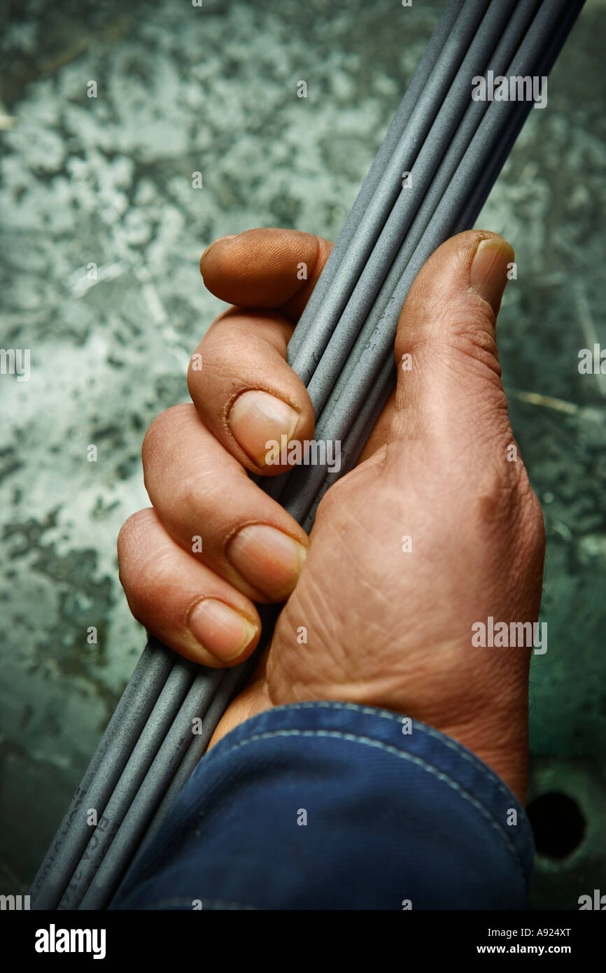 a hand with welding electrodes Stock Photo - Alamy