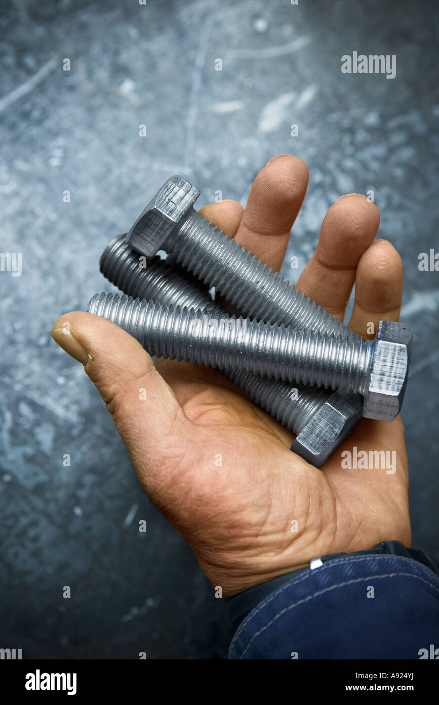 a hand with bolts Stock Photo - Alamy