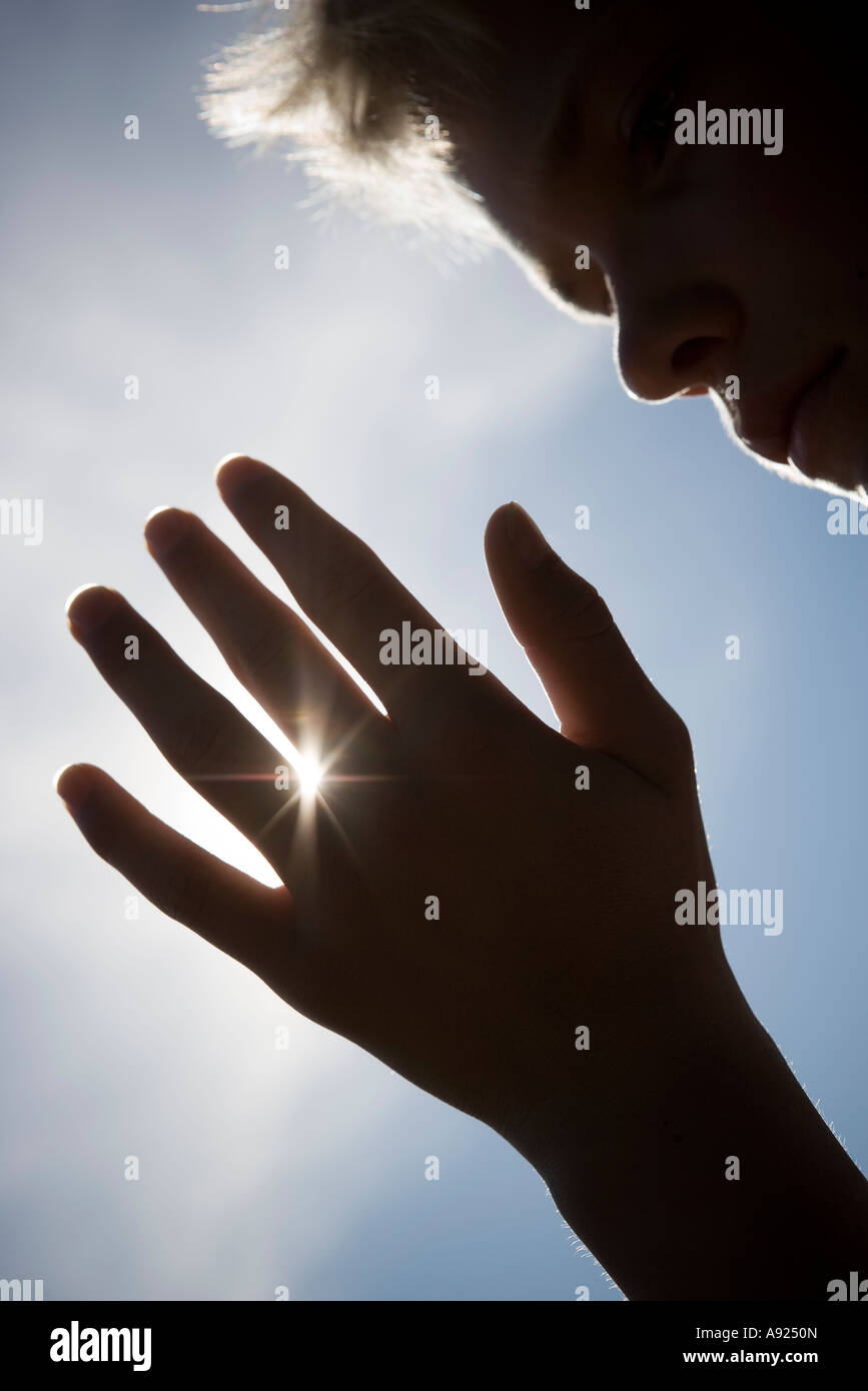 Hand blocking sun hi-res stock photography and images - Alamy