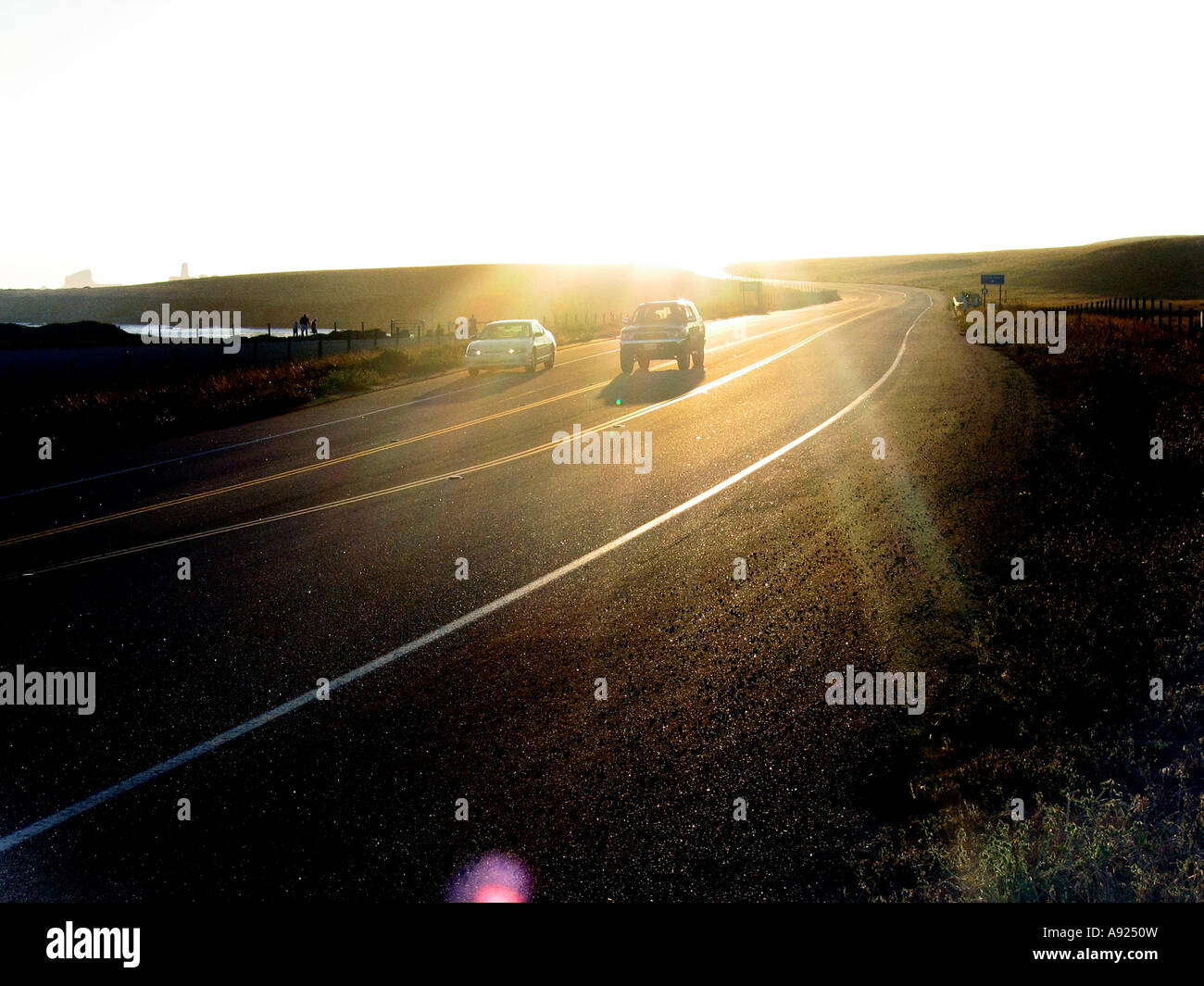 backlighted cars on the road Stock Photo - Alamy
