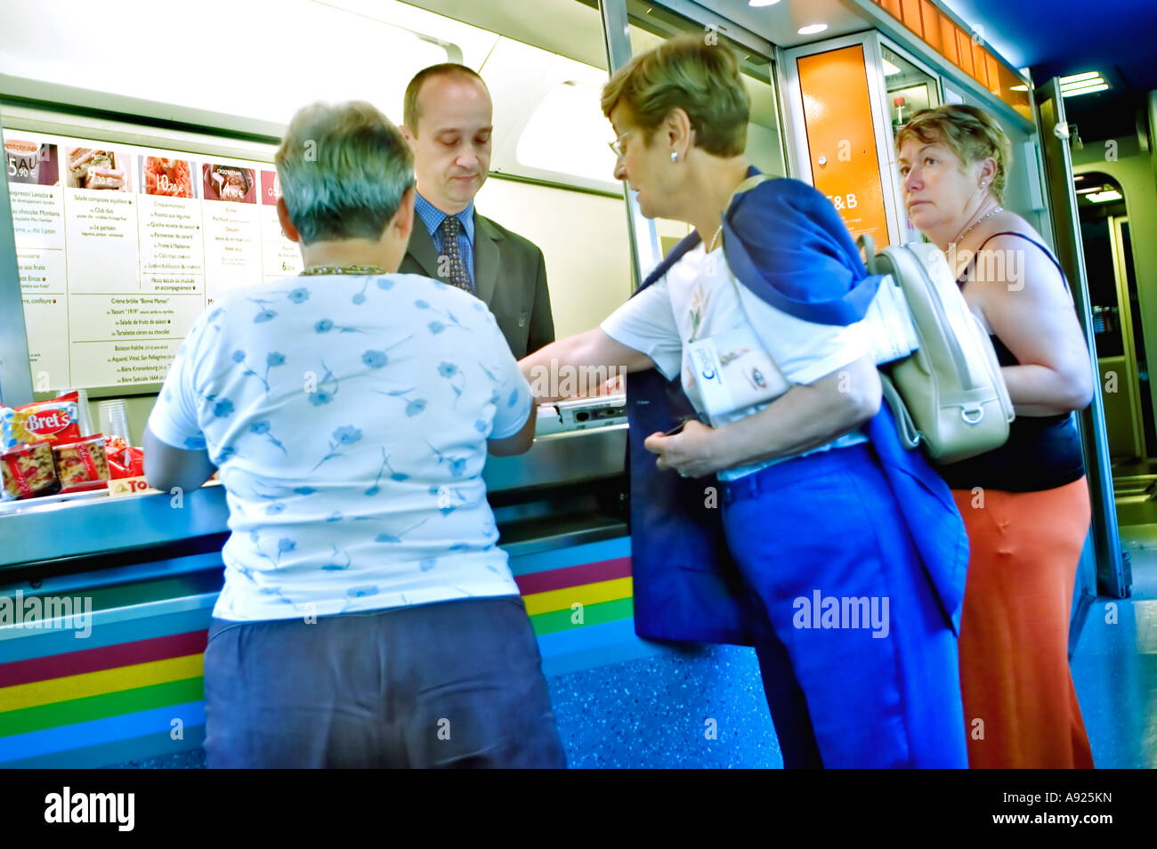 Senior Female passengers ordering Snacks in Fast Food Restaurant Wagon ...