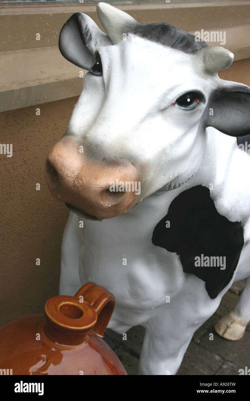 model of Friesian cow and earthenware milk jug Stock Photo - Alamy