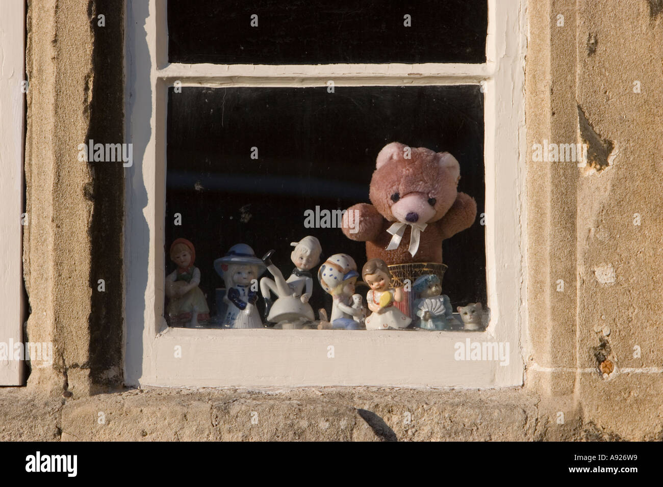 Cuddly toys in a window Stock Photo - Alamy