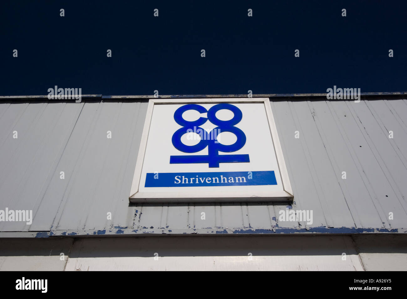 Co Op shop sign against bright blue sky Stock Photo - Alamy