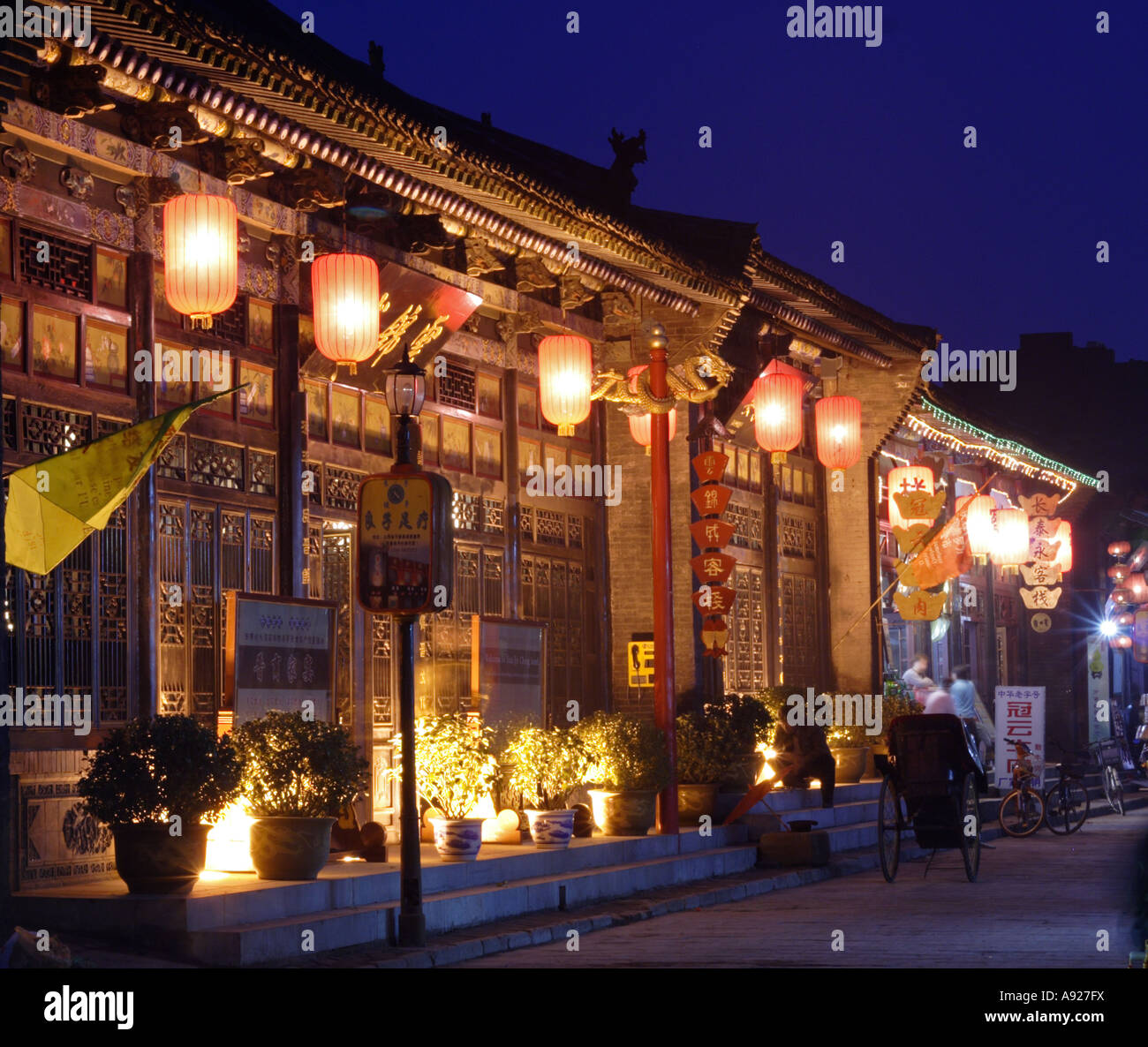 Lanterns shine at nightime outside restaurant in Pingyao near the ...