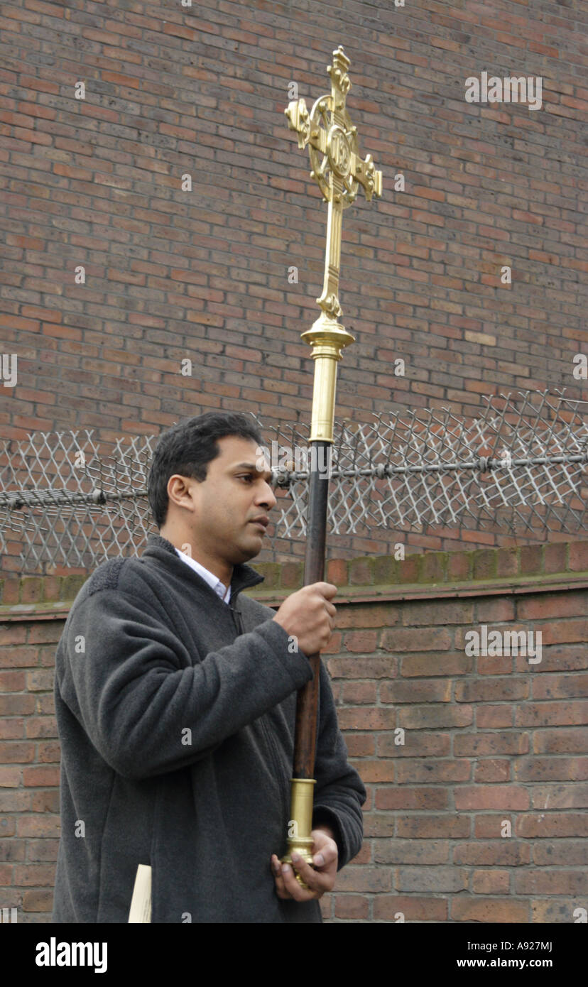 Asian worshipper at Church in London carries cross (crucifer) during ...