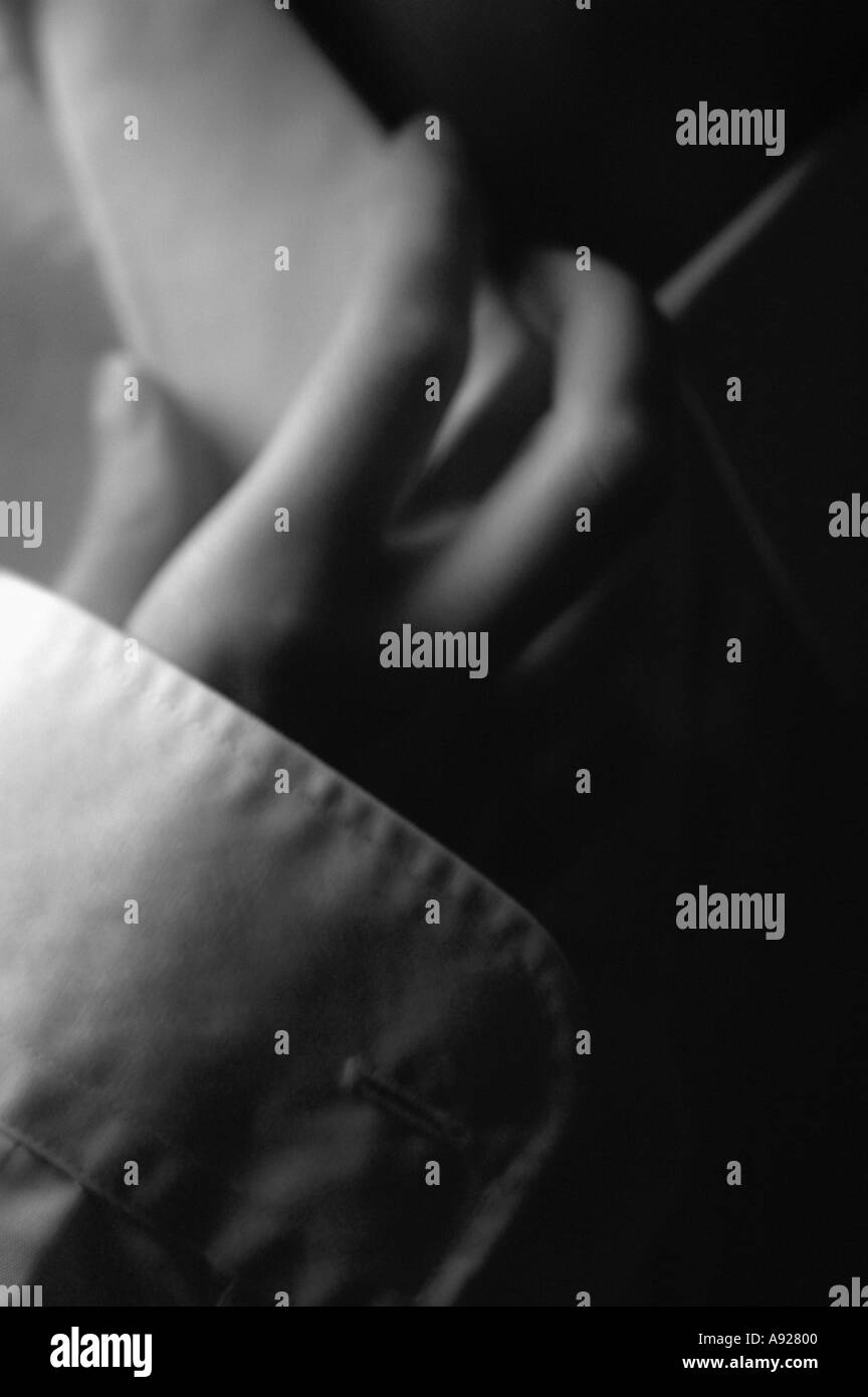 WOMAN TOUCHING NECK WITH HAND WEARING WHITE SHIRT Stock Photo - Alamy