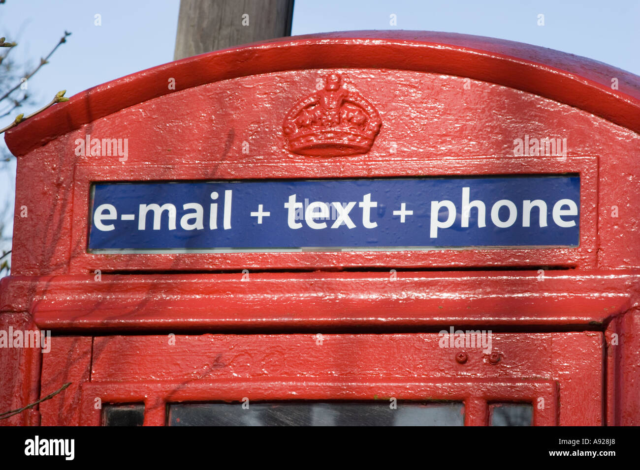Red telephone box in remote village offering modern SMS text and email ...