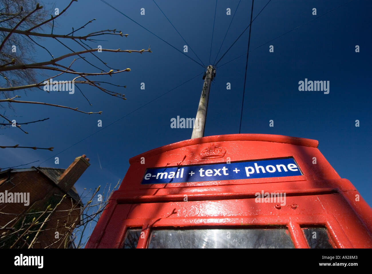 Red telephone box in remote village offering modern SMS text and email ...