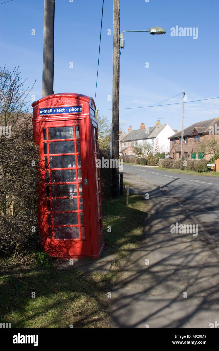 Red telephone box in remote village offering modern SMS text and email ...