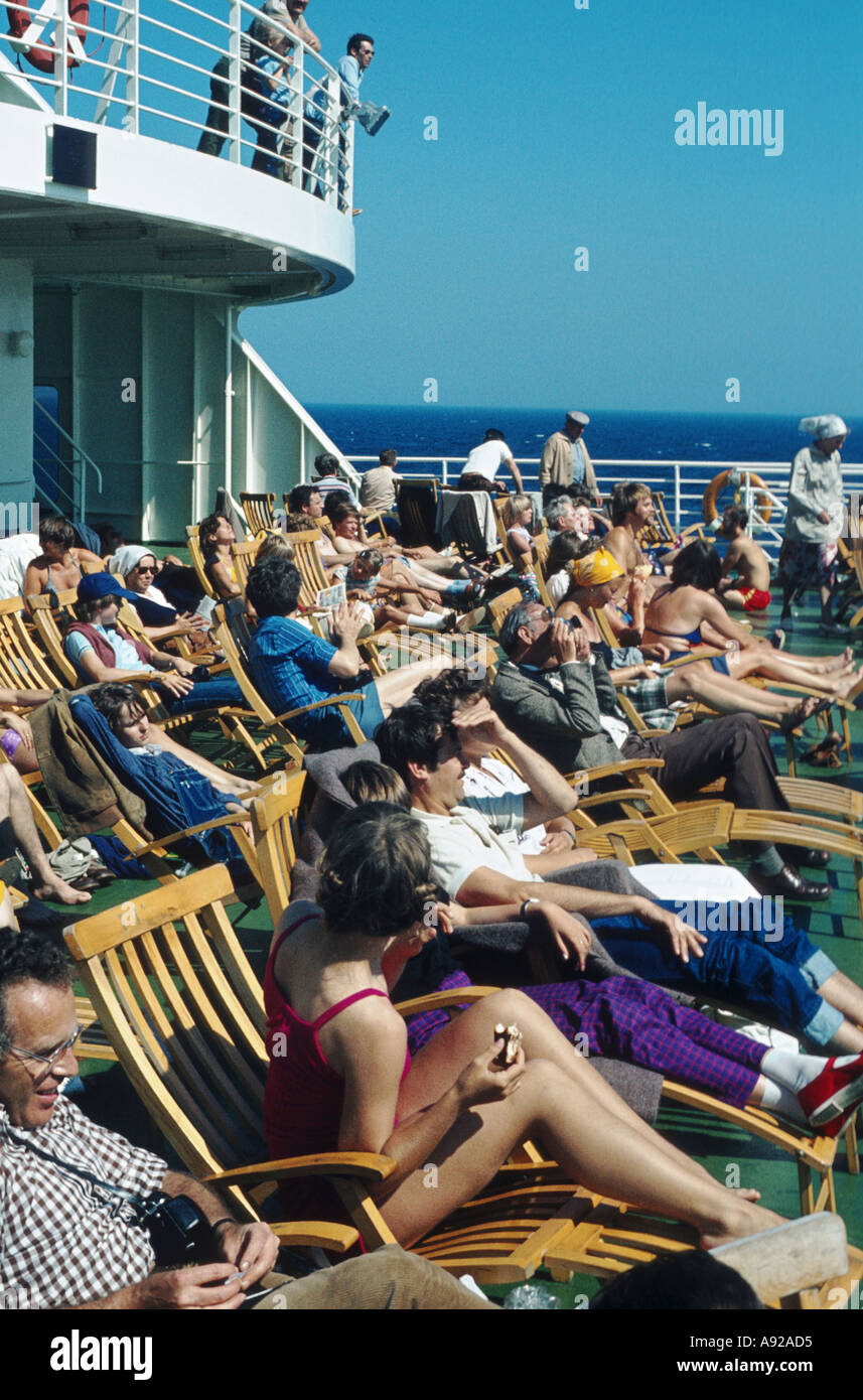 people on a ship cruise sun worshipper sunbathing sundeck sun deck ...