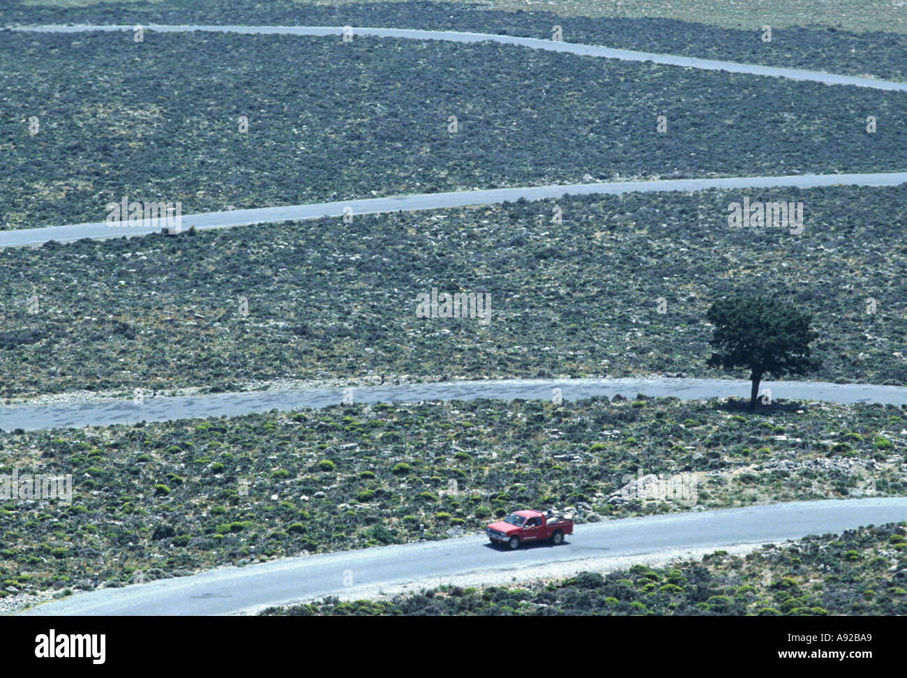 Greece crete island of Grete lonely street with a car winding road ...