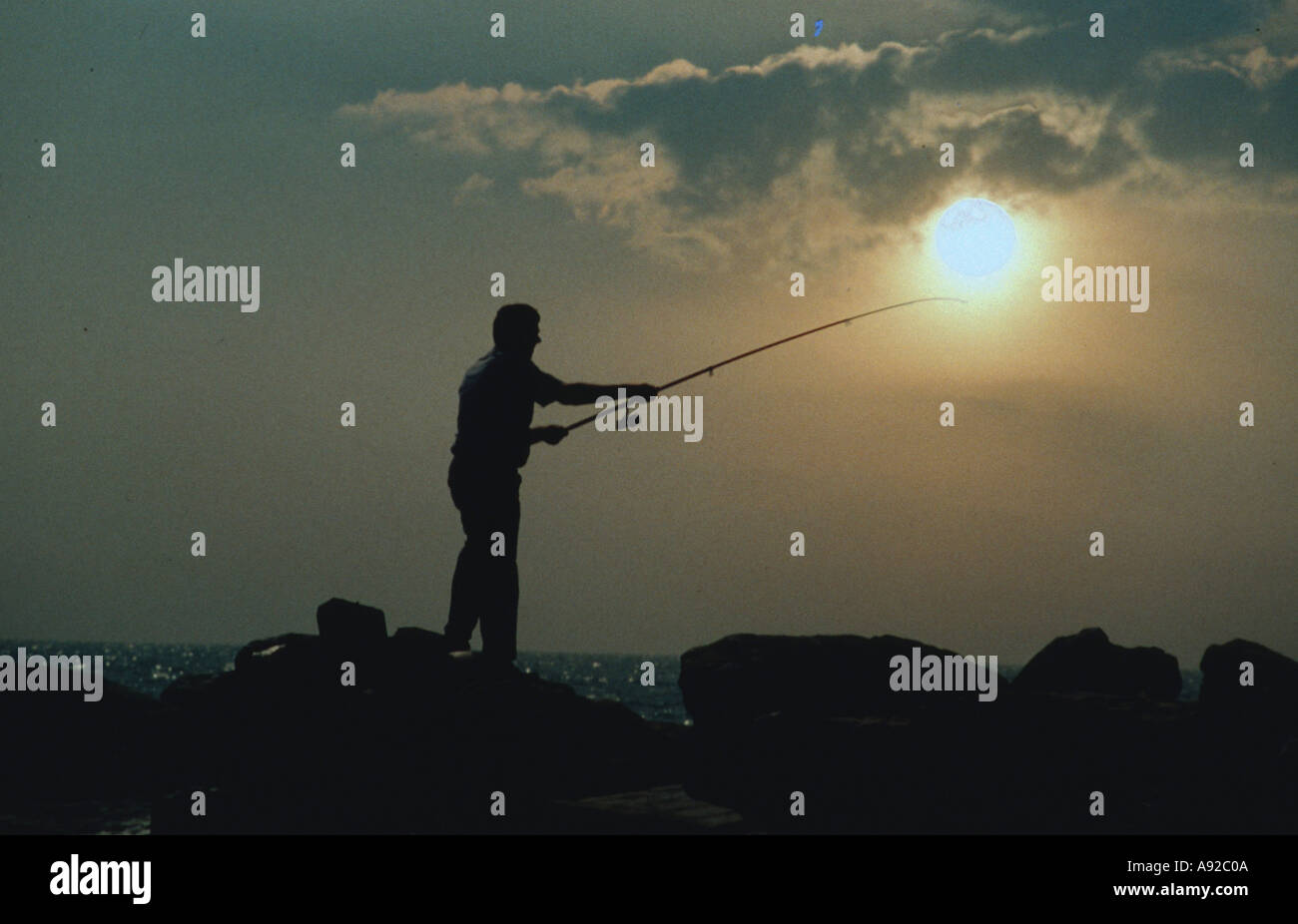 fisherman in the sundown angle fishing rod tackle hook catching ...