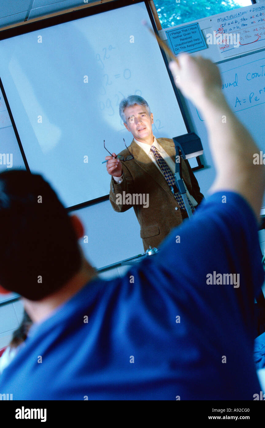 Teacher teaching in a classroom Stock Photo - Alamy