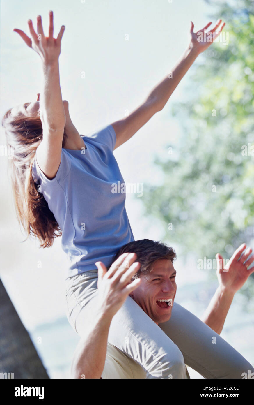 Two men carry woman look hi-res stock photography and images - Alamy