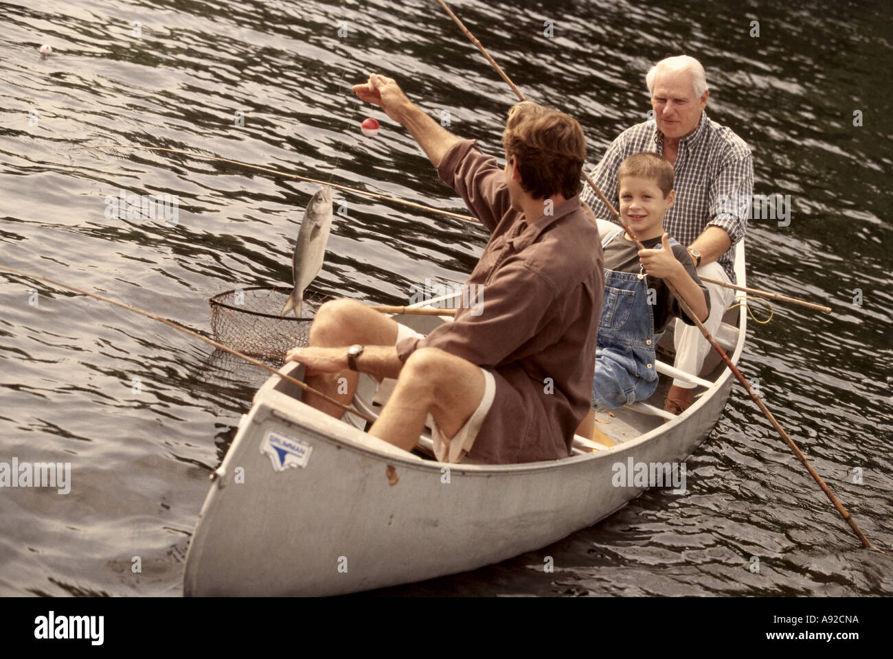 Family rowboat fishing rod hi-res stock photography and images - Alamy