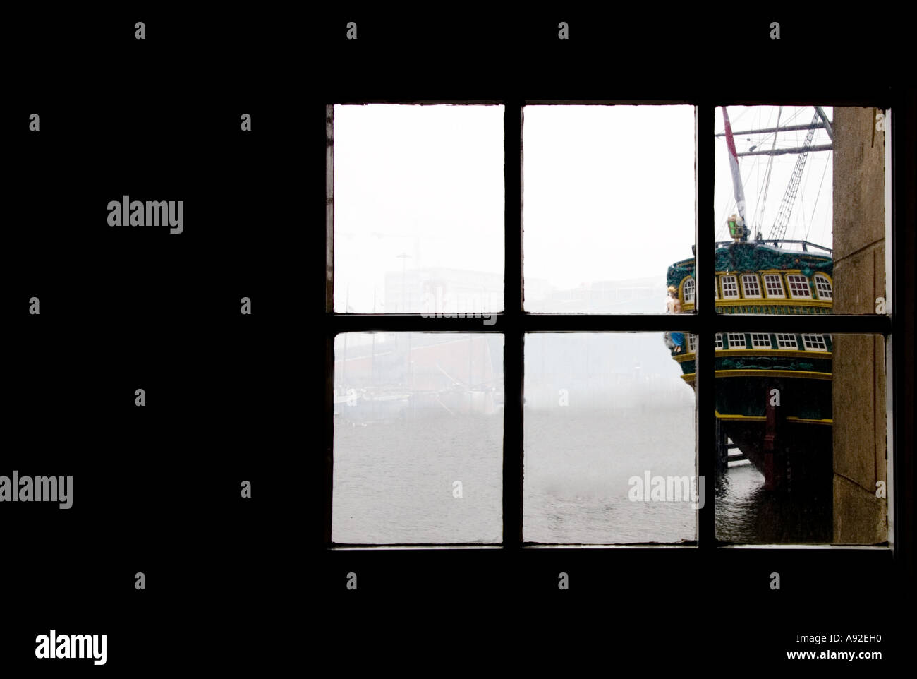 Historic sailing ship viewed from a multi paned window Stock Photo - Alamy