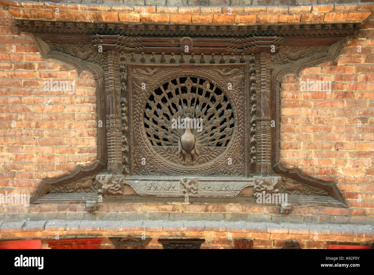 Peacock window wood carving Bhaktapur Nepal Stock Photo - Alamy