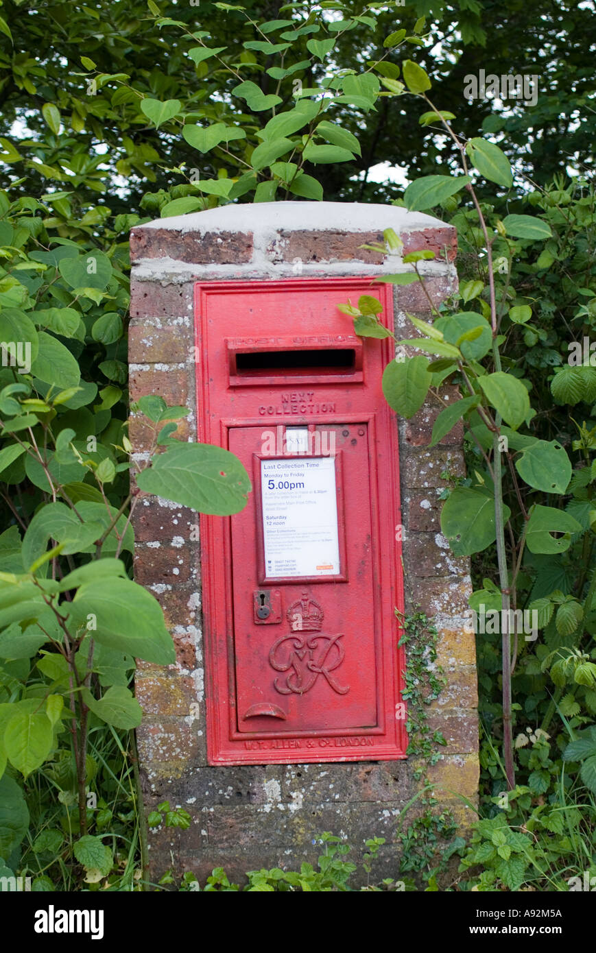 red royal mail post box in country lane Stock Photo - Alamy