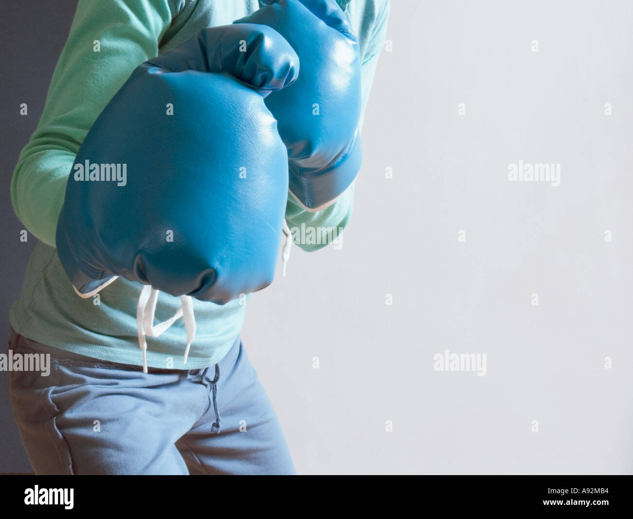 Girl boxing blue gloves working hi-res stock photography and images - Alamy