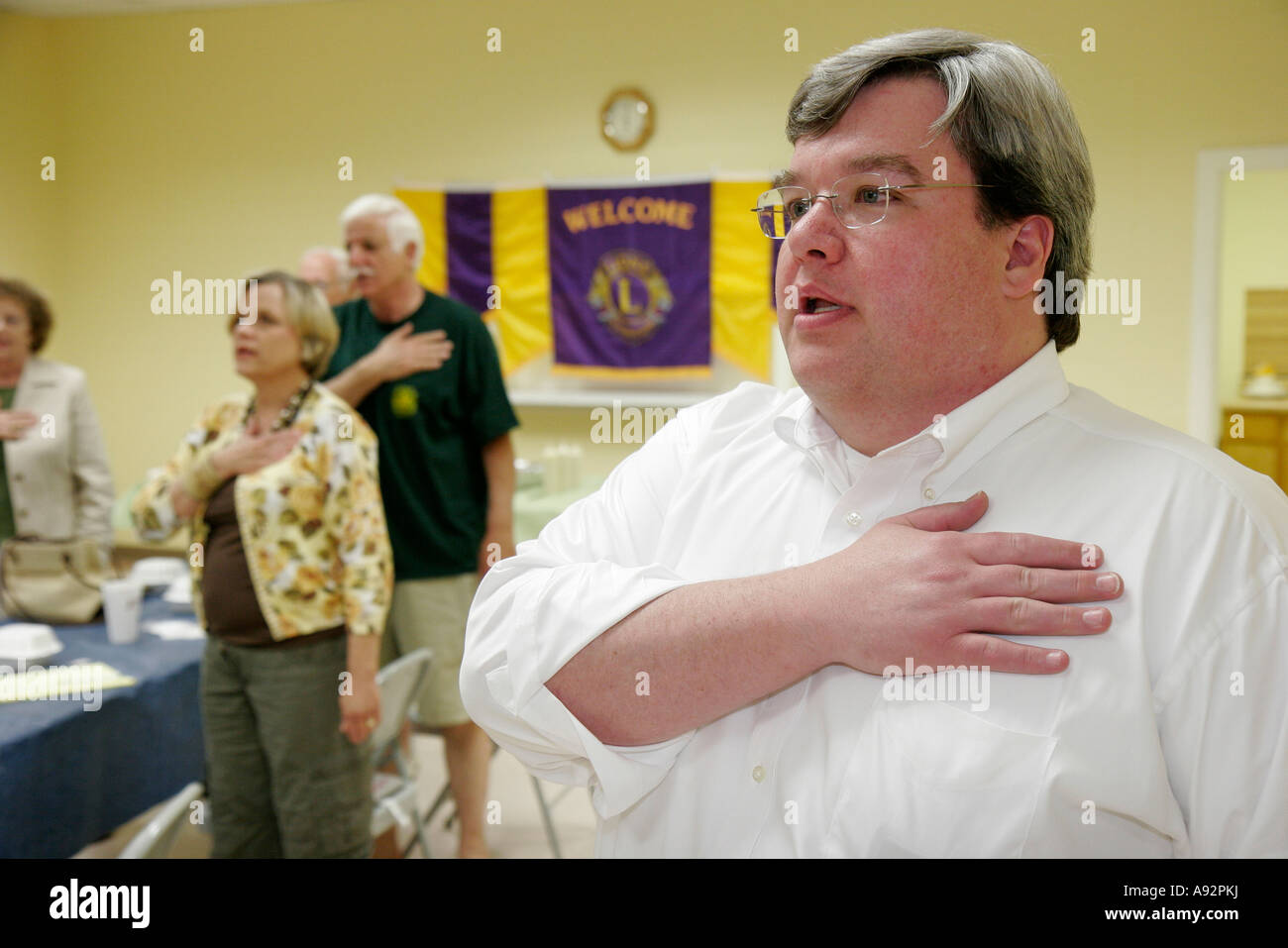 Pledge of allegiance members saying reciting hand heart hi-res stock ...