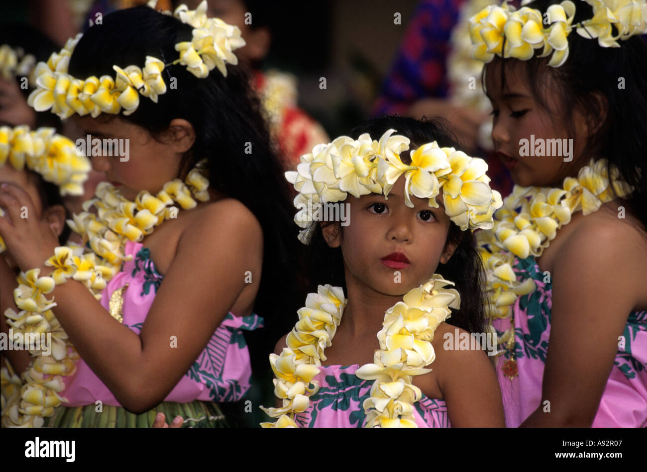 Young girls in Hawaii costumes and leis await hula dance Aloha Stock ...