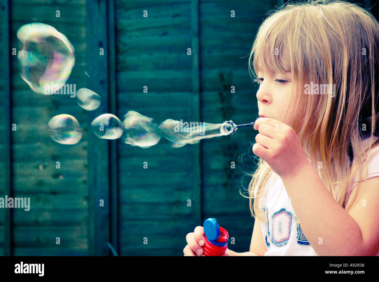 Child Blowing Bubbles Stock Photo - Alamy